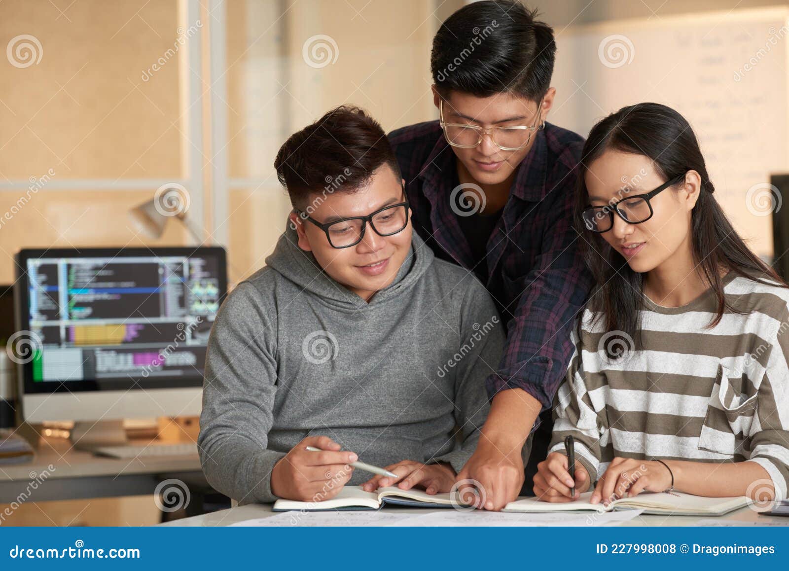 College Student Helping Friend with Project Stock Photo - Image of ...