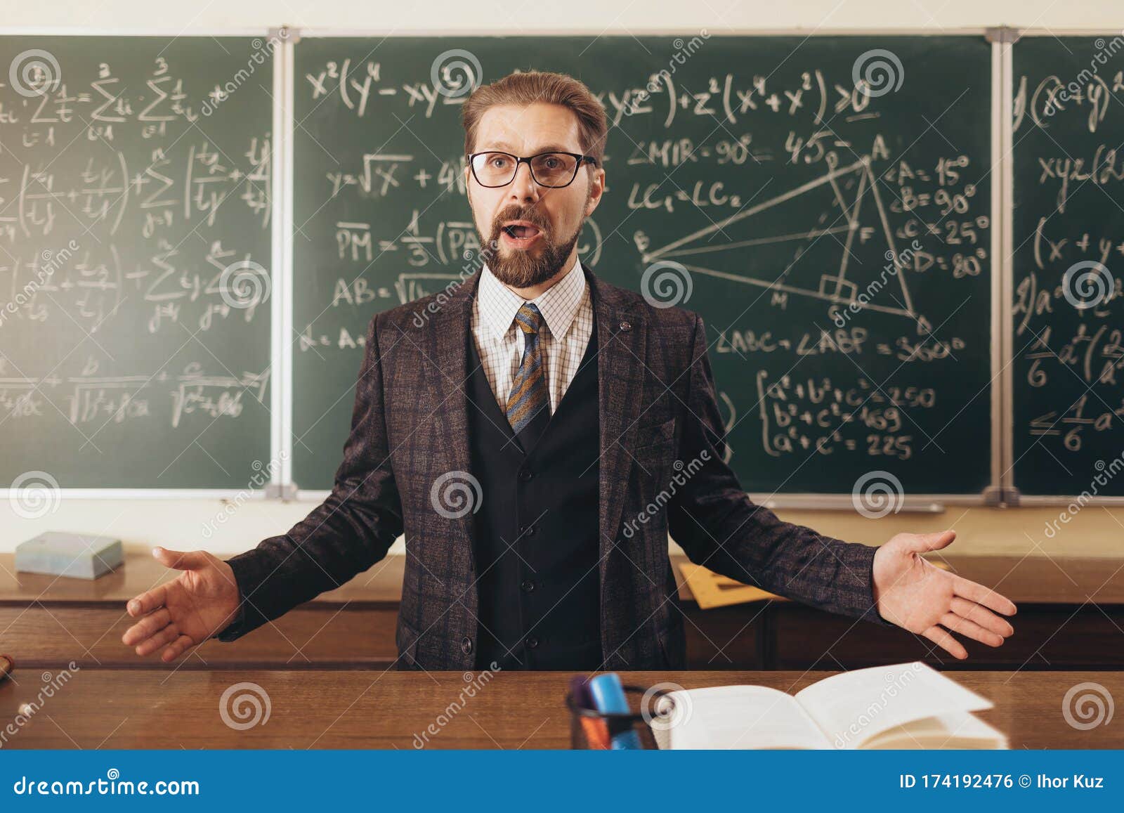 Smart Professor in Suit and Glasses Explaining New Material Stock Photo ...