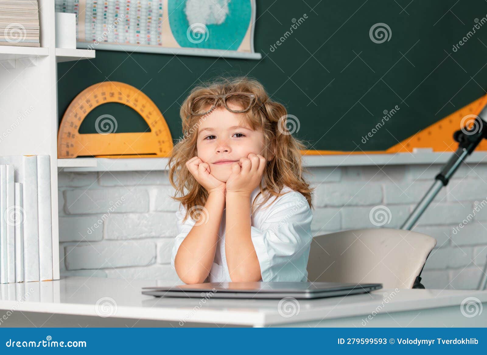 A Smart School Boy Sitting at the Table, Preparing for the Exam. Stock ...
