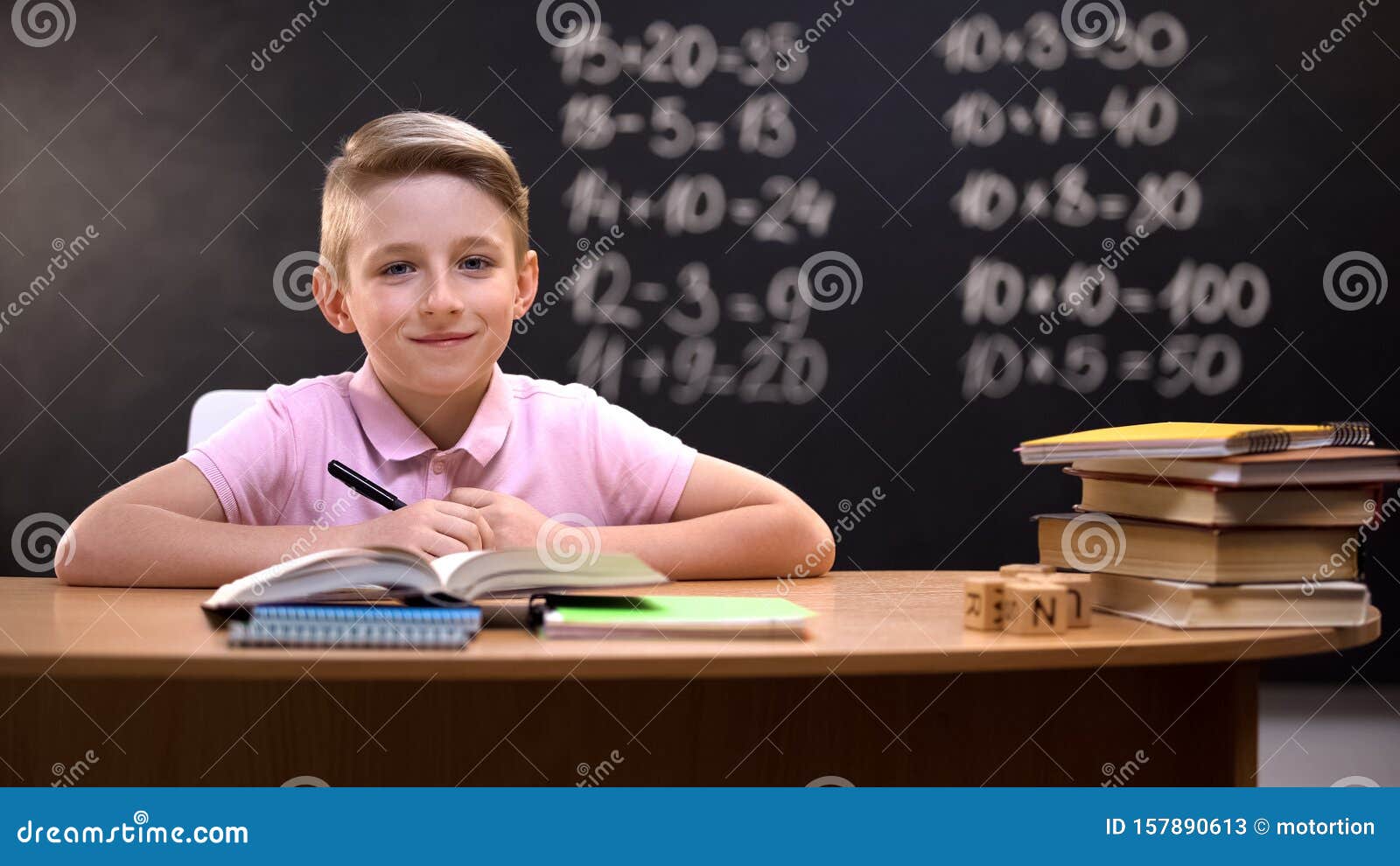 Smart Schoolboy Smiling To Camera after Solving Task, Exercises Written ...