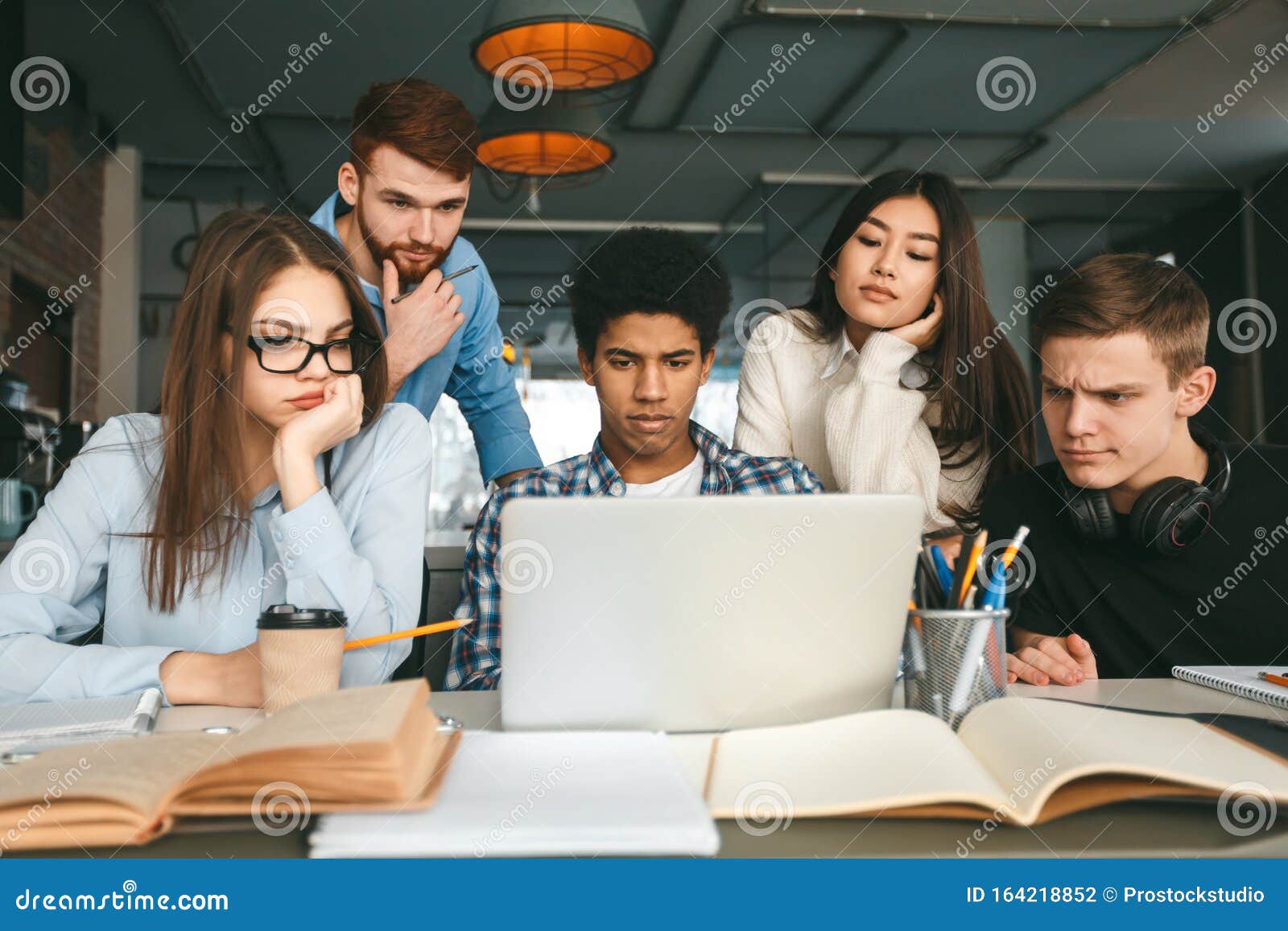 Smart Serious Students Working on Project in Front of Laptop Stock ...