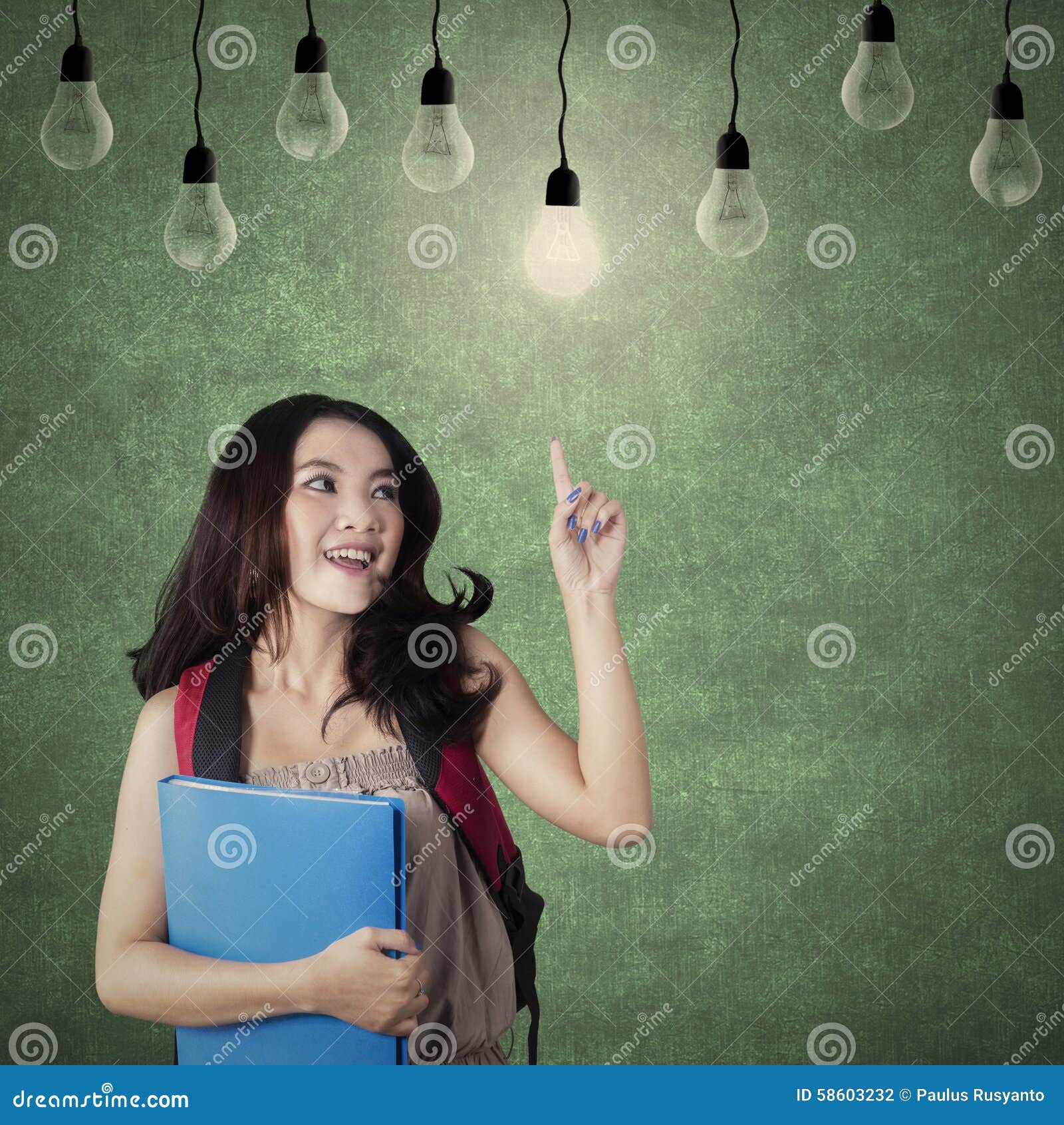 Smart Student Choosing a Bright Light Bulb Stock Photo - Image of ...