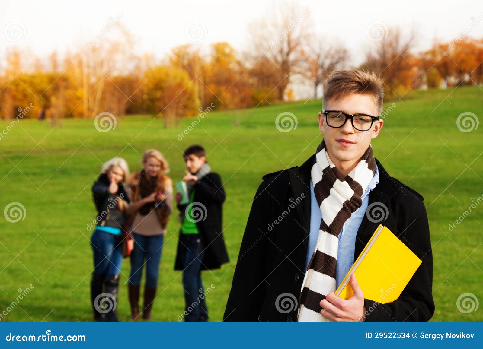 Smart student with friends stock photo. Image of brunet - 29522534