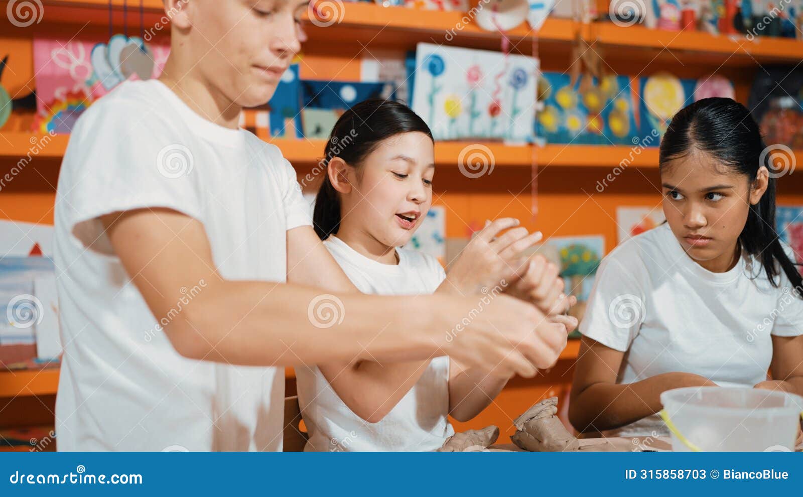 Smart Student Using Hand Press on Clay Piece at Pottery Workshop ...