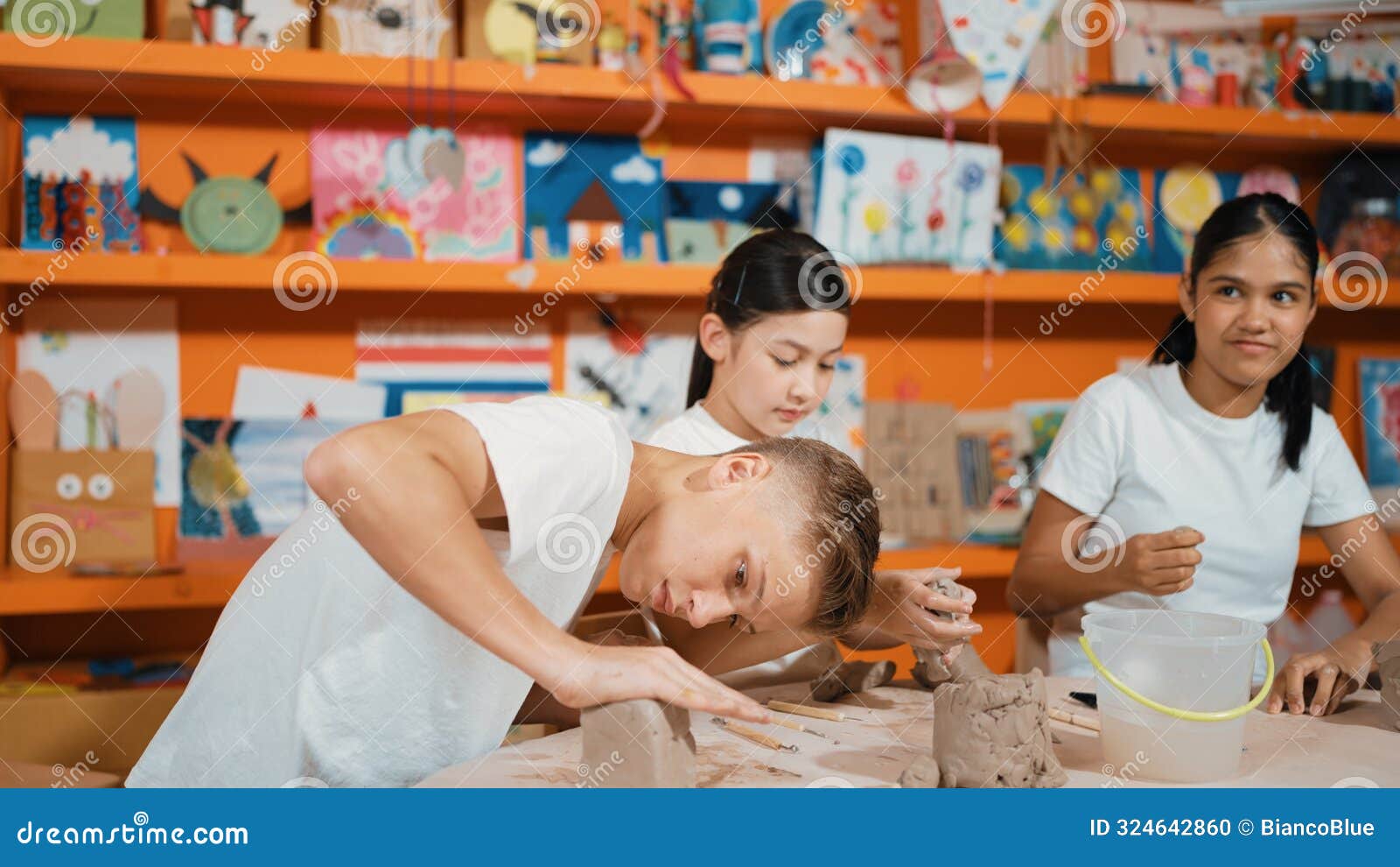 Smart Student Using Hand Press on Clay Piece at Pottery Workshop ...