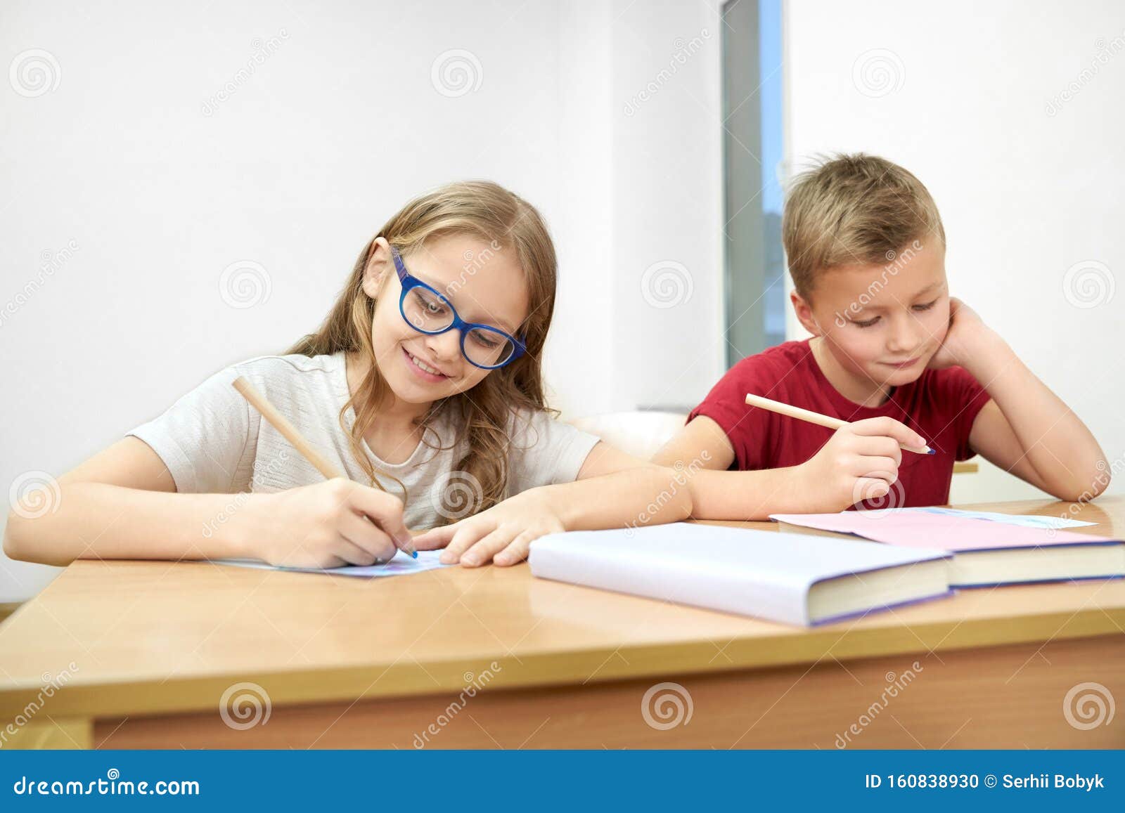 Smart Students Sitting in Classroom and Doing Test at School Stock ...