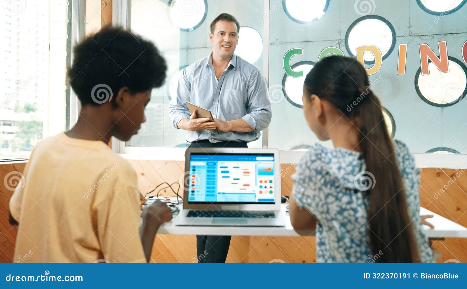 Smart Teacher Hold Tablet while Back View Student Learning Code. Edification. Stock Image ...