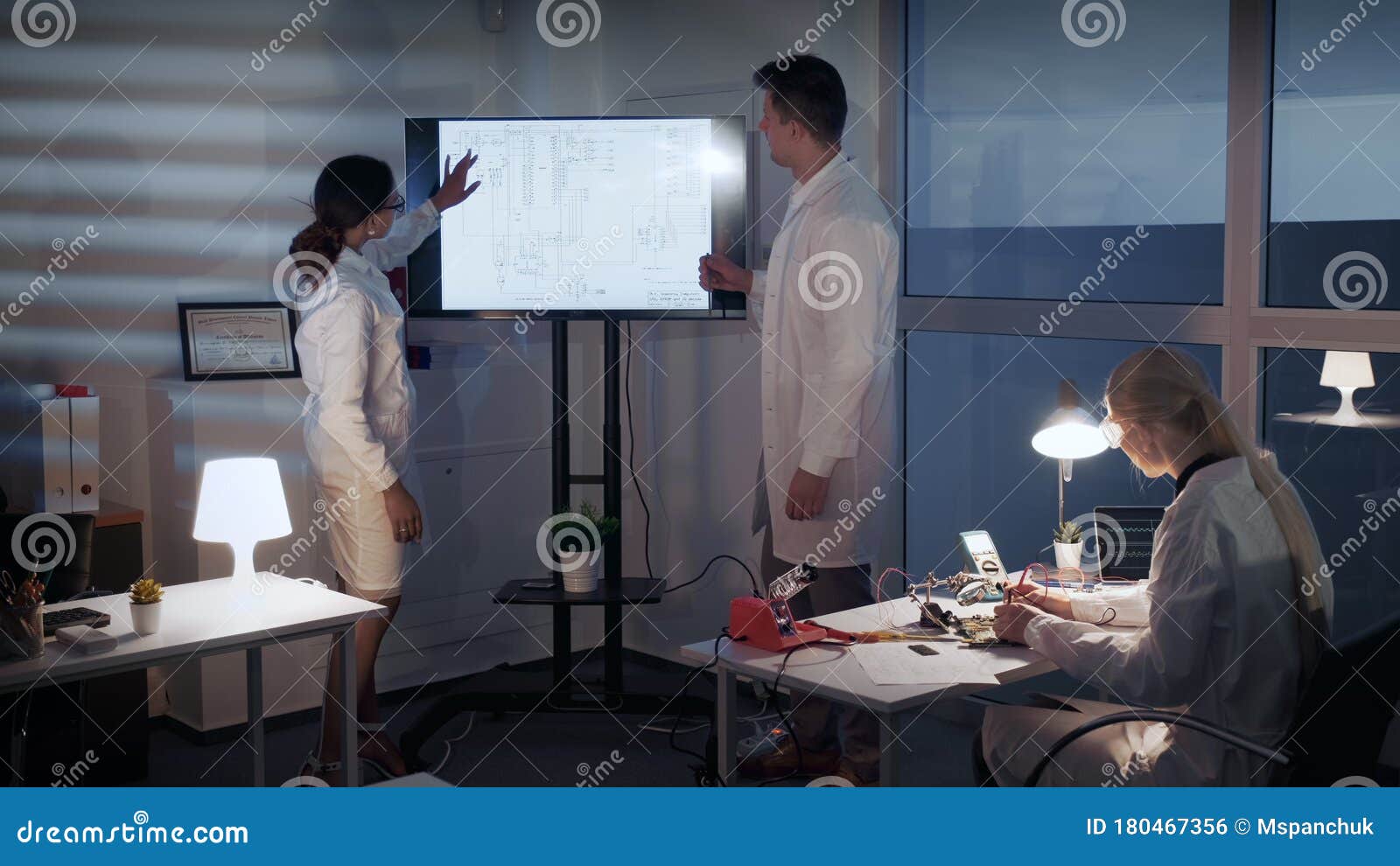 Smart Team of Electronics Development Engineers Discussing Something on ...
