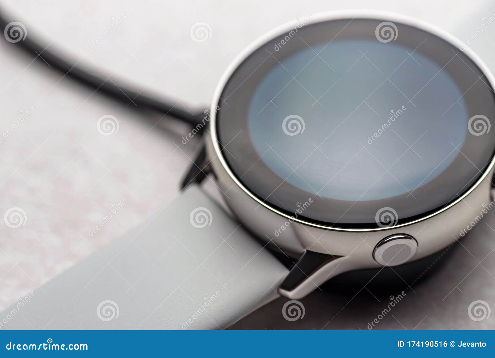 Smart Watch Wireless Charging on Charging Pad on Kitchen Worktop Table ...