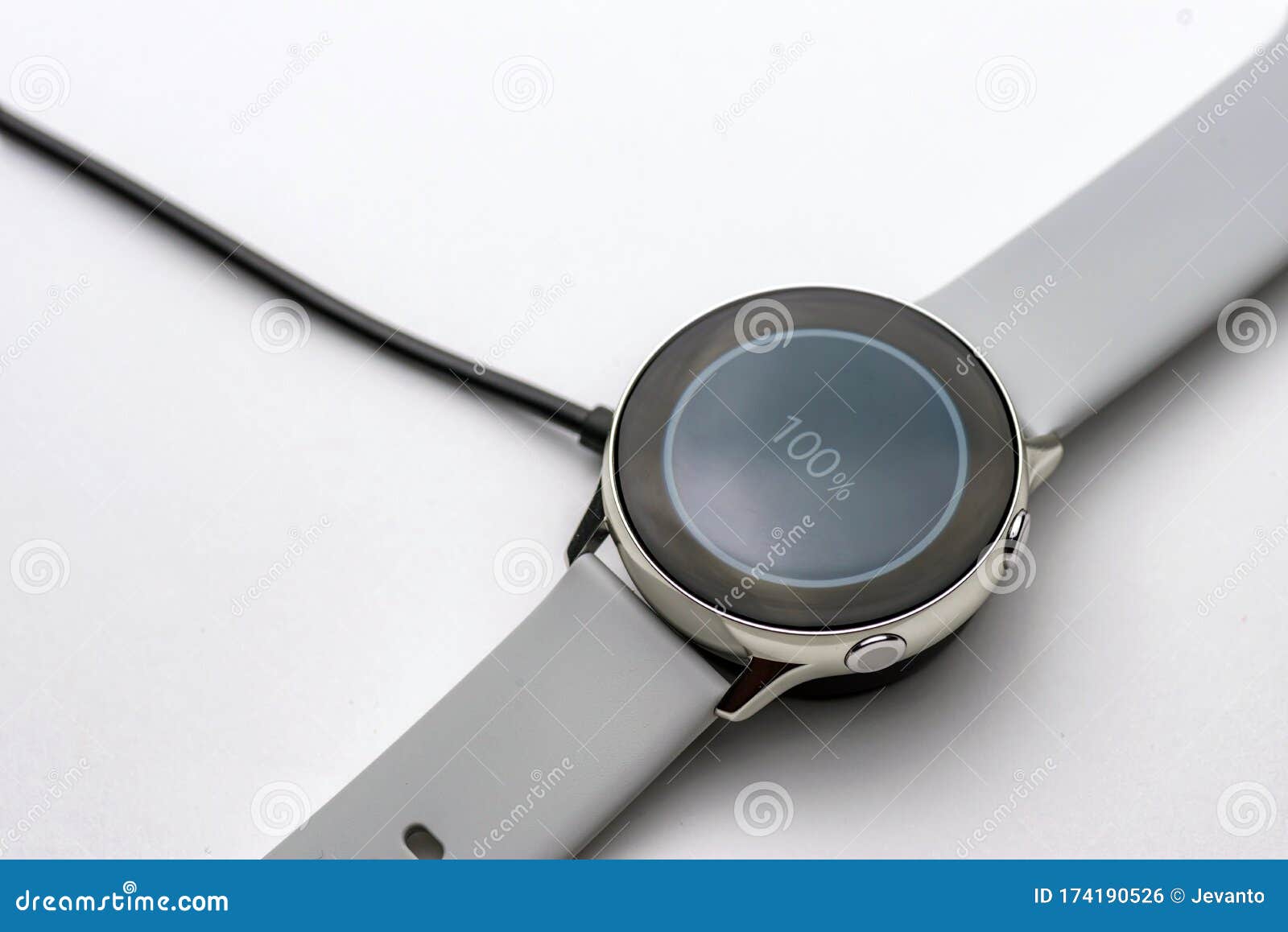 Smart Watch Wireless Charging on Charging Pad on Kitchen Worktop Table ...