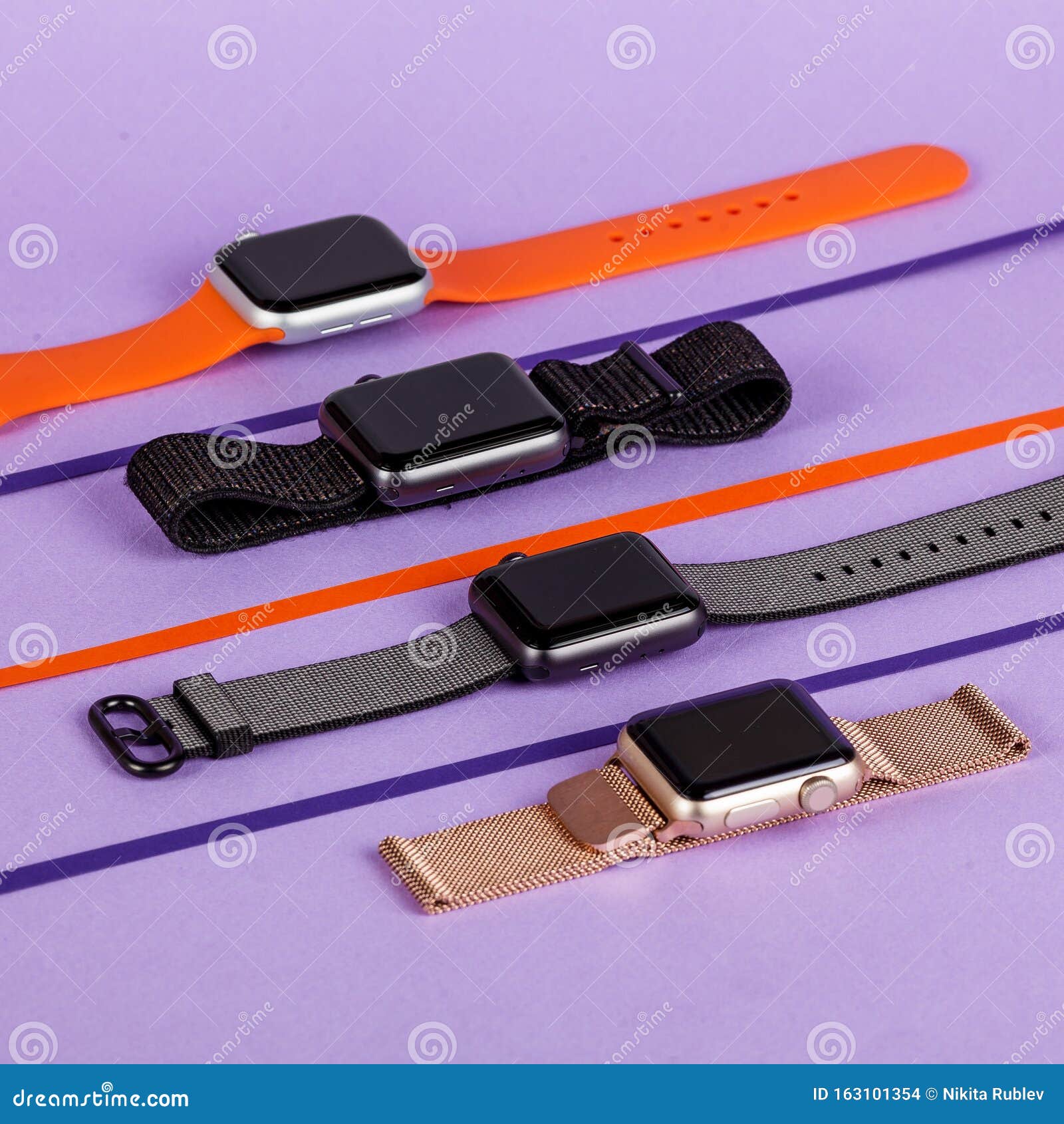 Smart Watches with Different Straps on Colorful Background Stock Photo ...