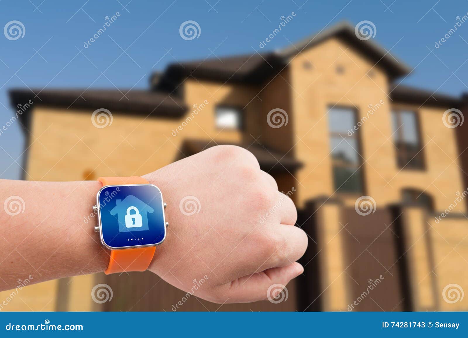 Smart Watches with Home Security App on a Hand on the Building ...