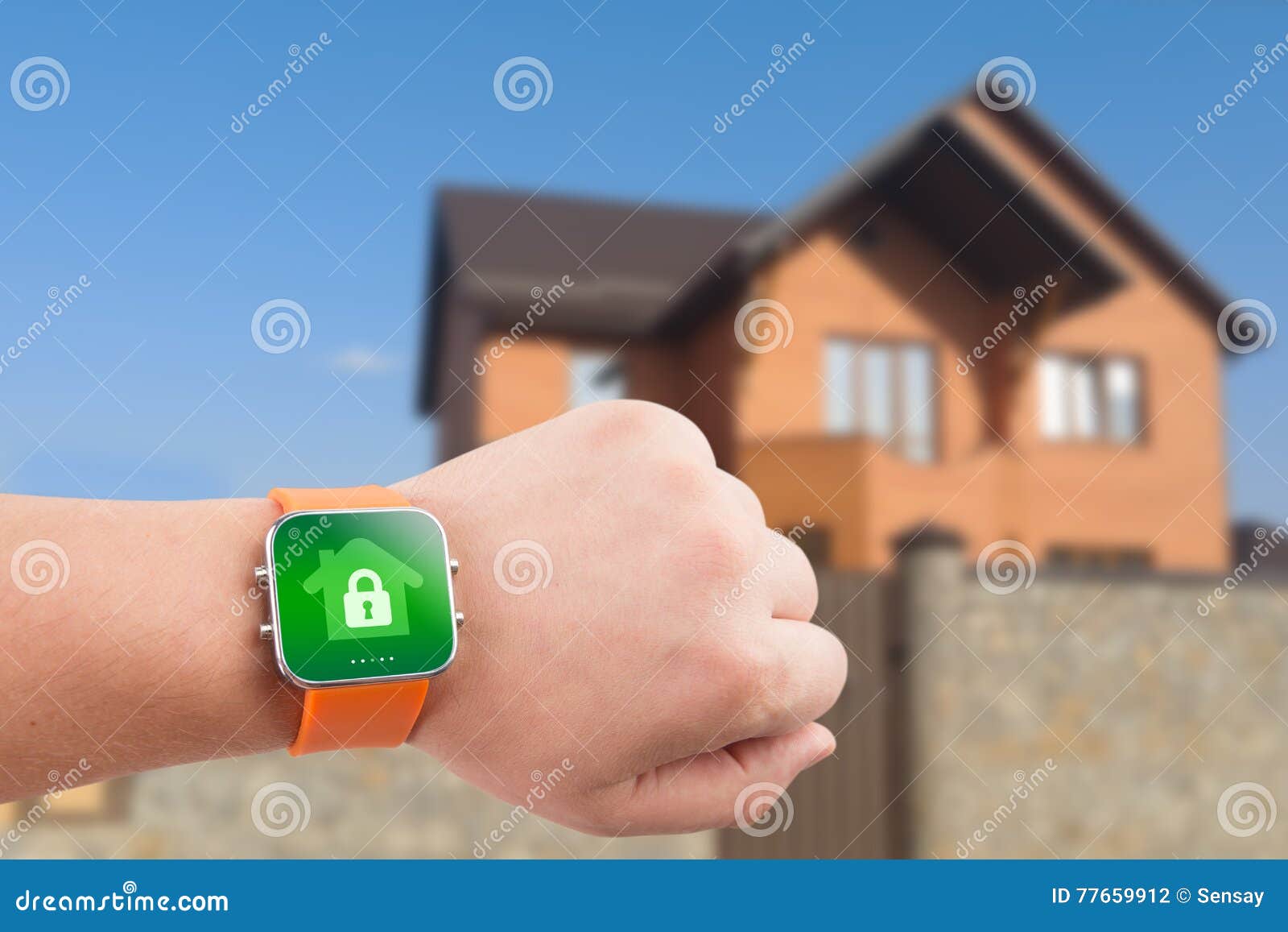 Smart Watches with Home Security App on a Hand on the Building ...