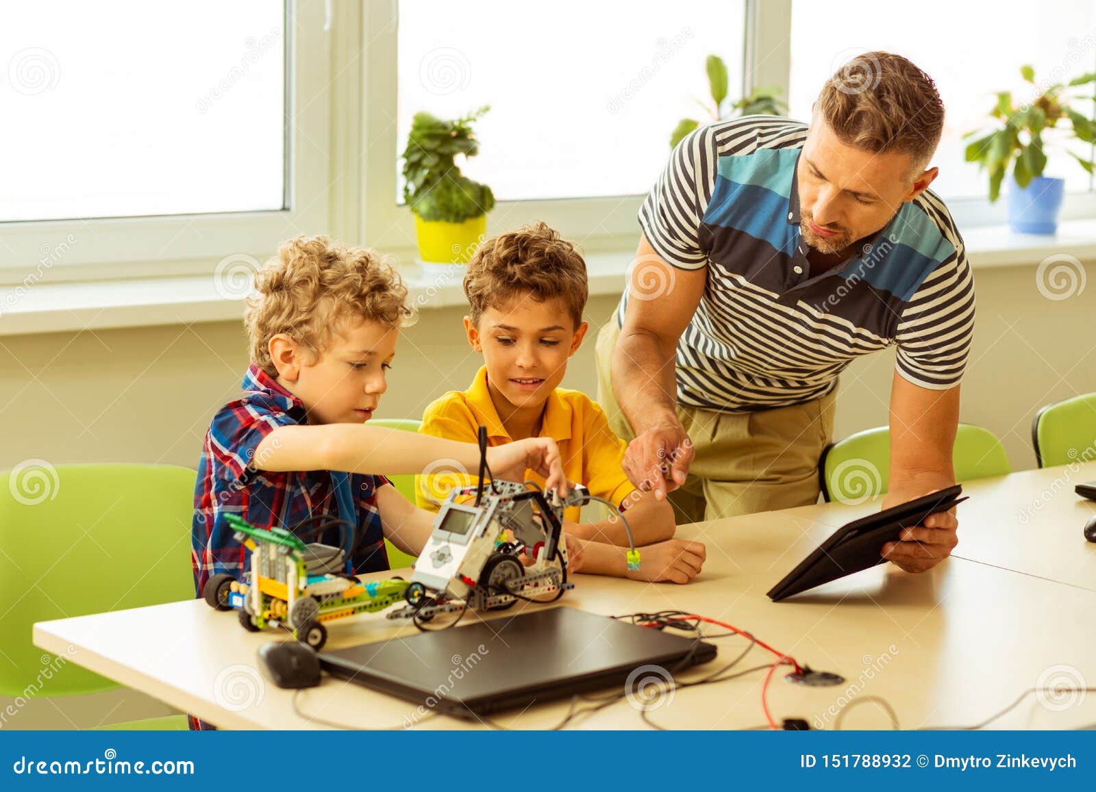 Smart Young Boys Constructing a Car Model Together Stock Photo - Image ...