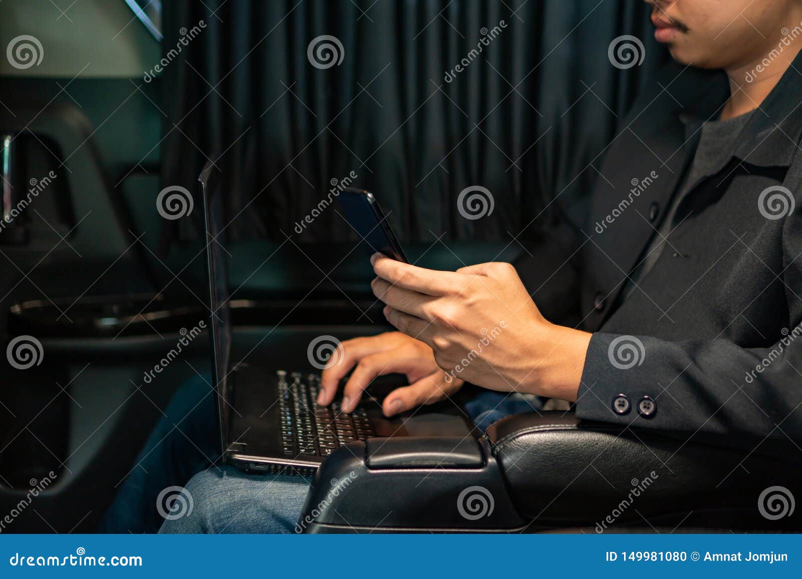 Young Businessman Using Mobile Phone and Laptop in Car Stock Photo ... Young Businessman Using Mobile Phone and Laptop in Car Stock Photo ...