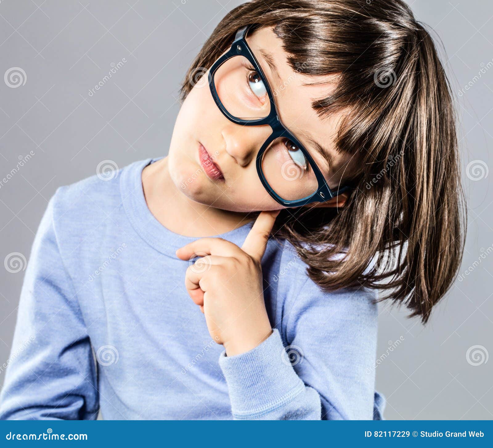 Smart Young Child Serious Eyeglasses Holding Head Intelligence Stock ...