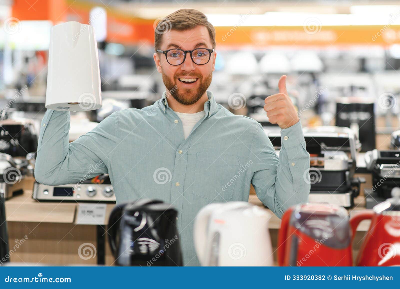Smart Young Customer Chooses a Kettle in Supermarket Mall Stock Photo ...