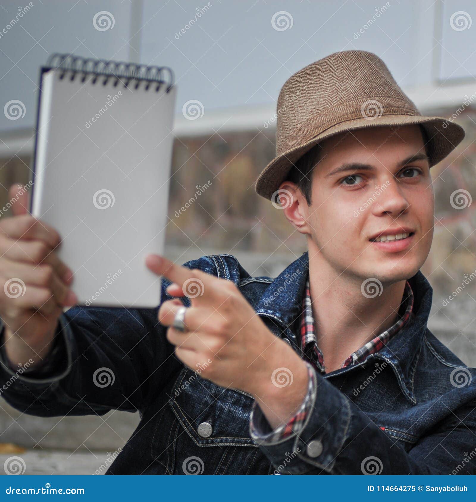 Smart Young Man Hold Notepad with Mock Up Area for Your Advertising ...