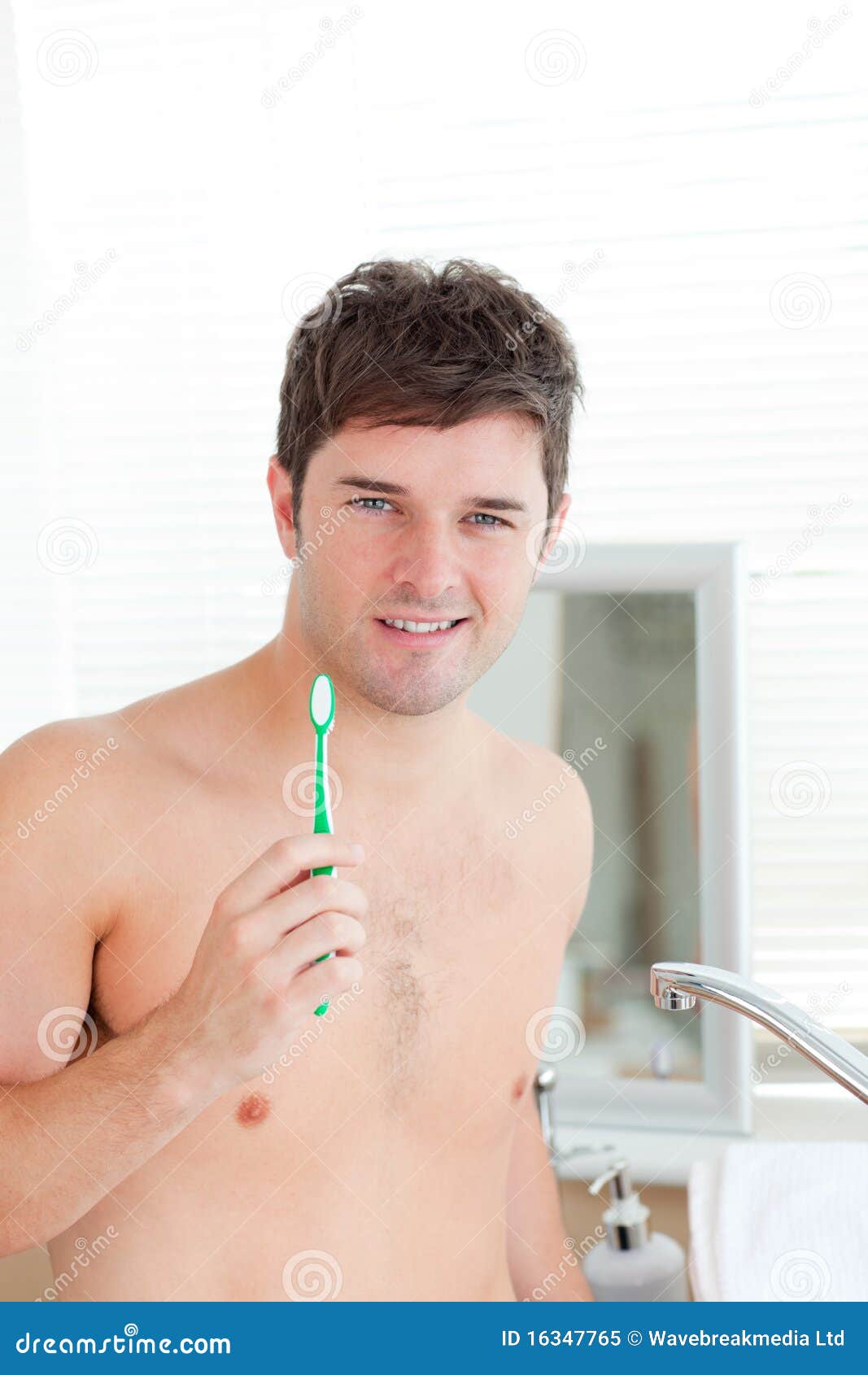 Smart Young Man Holding His Toothbrush in Bathroom Stock Image - Image ...