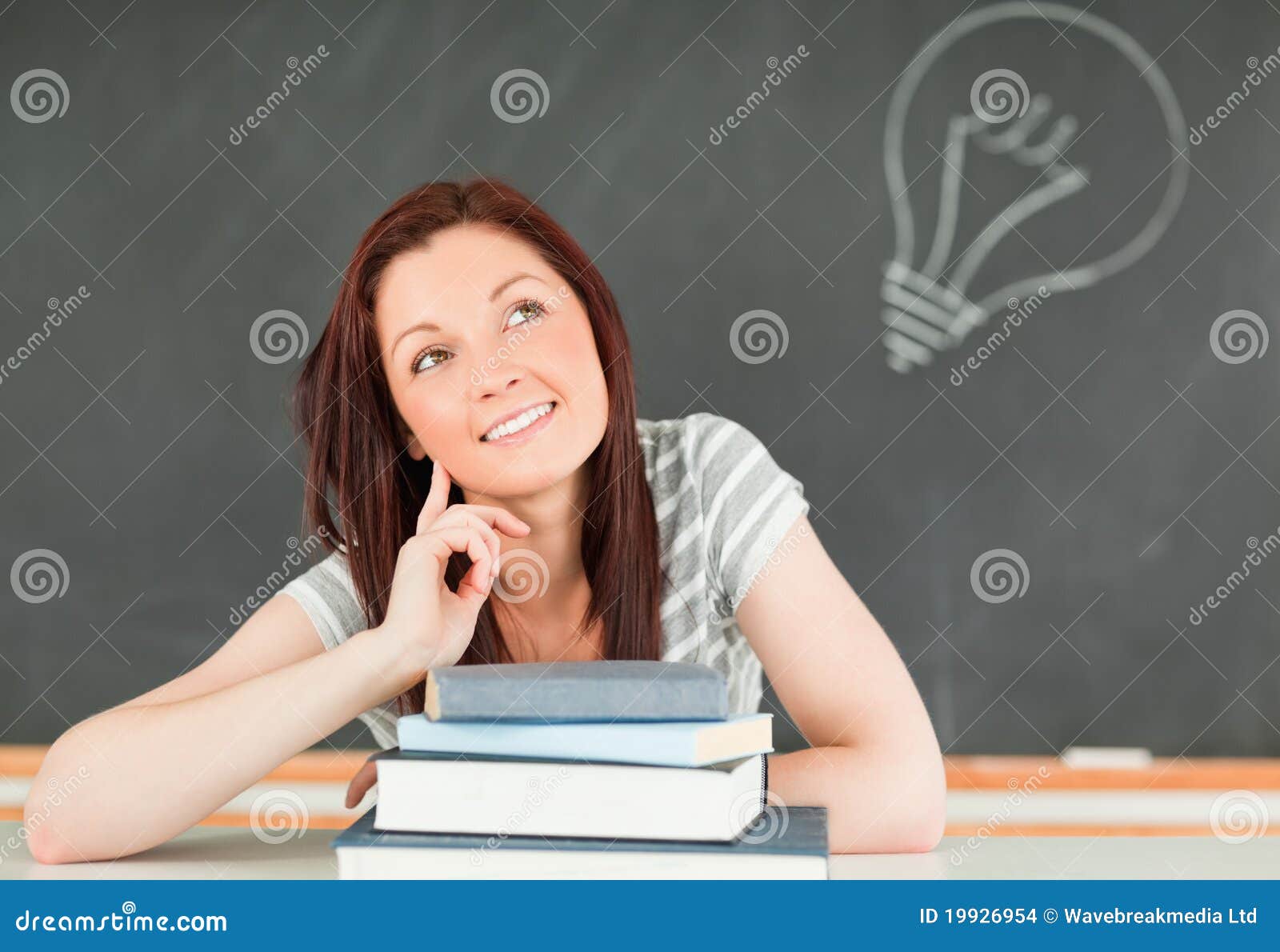 Smart Young Student in a Classroom Stock Photo - Image of book, green ...