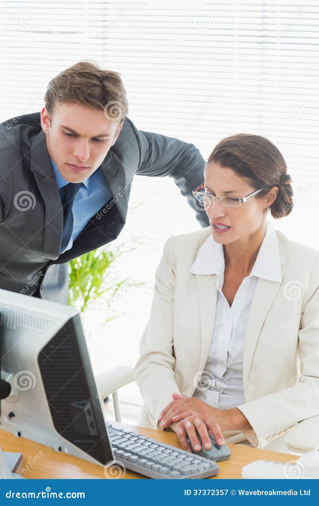 Smartly Dressed Business Couple Using Computer Stock Image - Image of ...