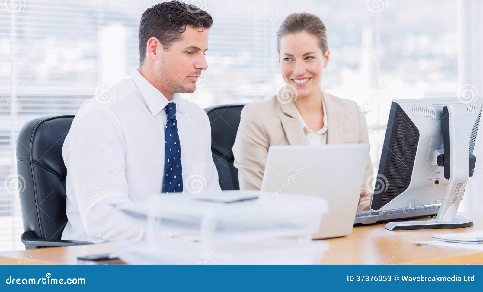 Smartly Dressed Colleagues Using Computer Stock Image - Image of ...
