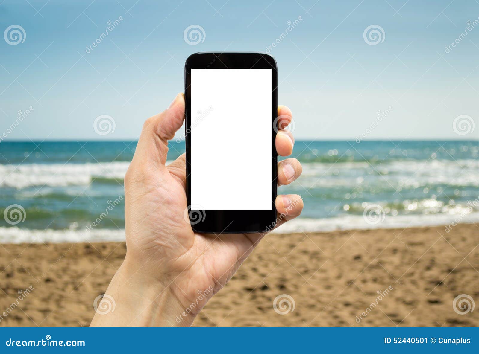 Smartphone on the beach stock image. Image of information - 52440501