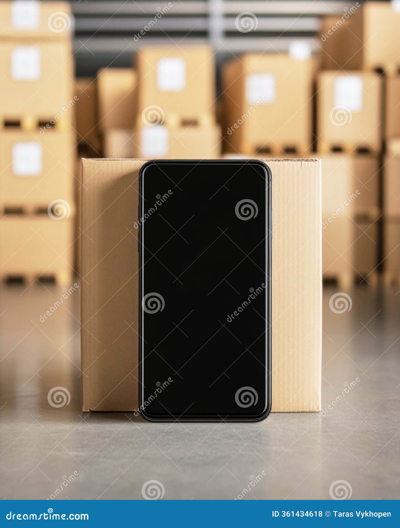 Smartphone on Cardboard Box in Modern Warehouse with Natural Lighting ...