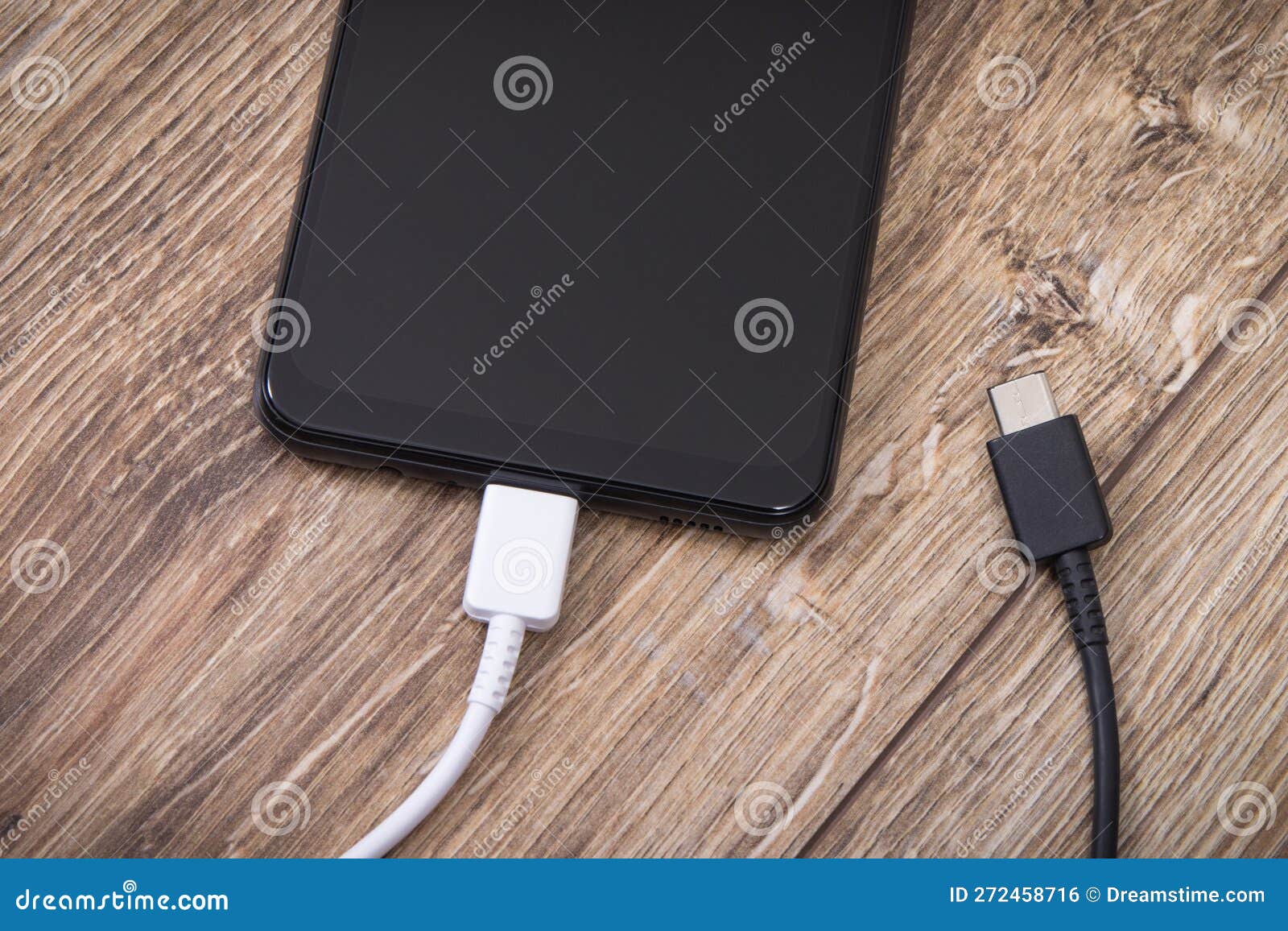 Smartphone with Charger Cables. Telephone Charging Concept Stock Photo ...