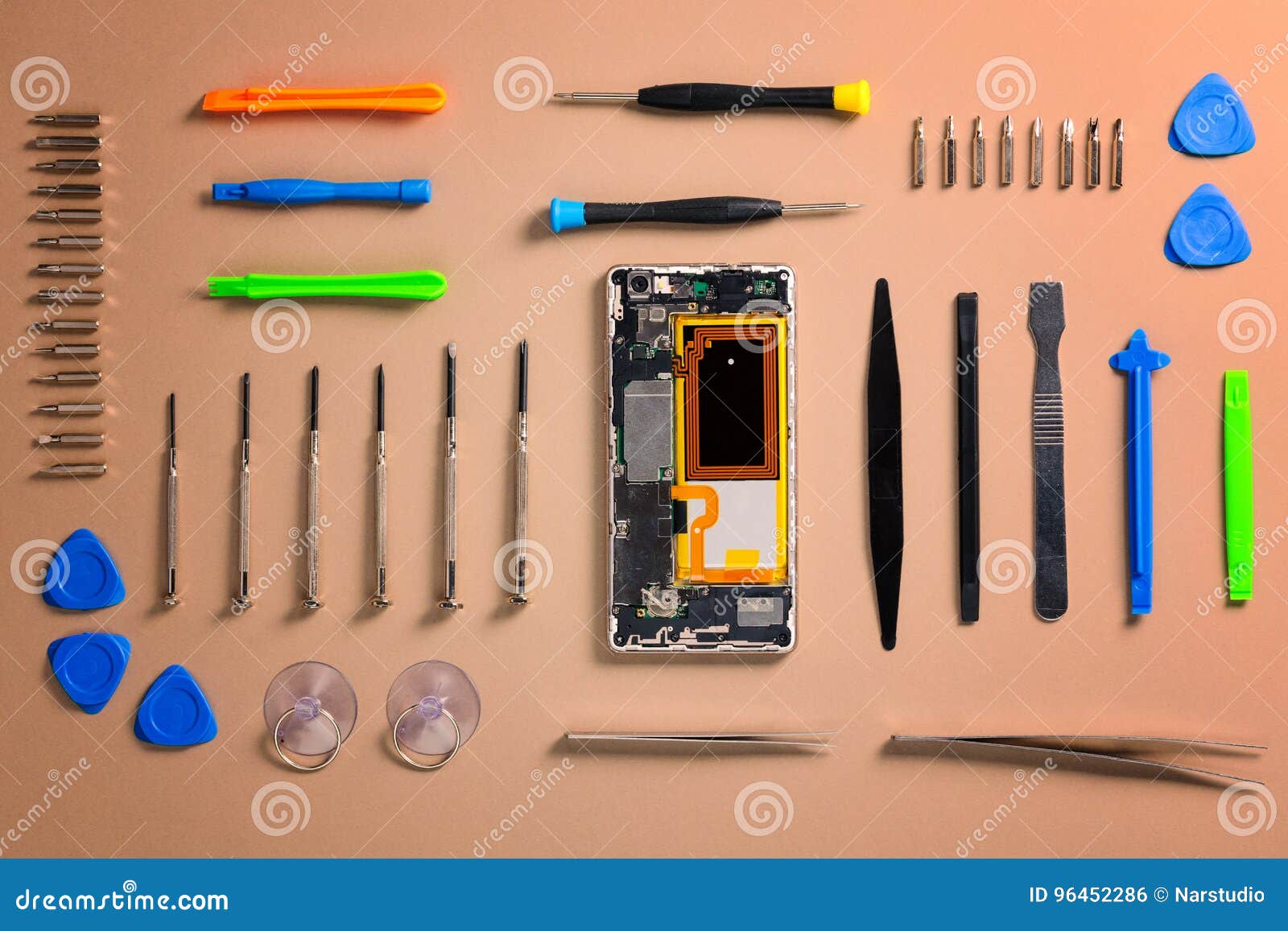 Smartphone Cover Removed, Internals Exposed with Tools Arranged Around ...