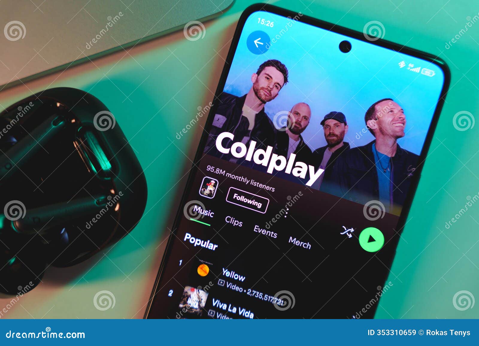 A Smartphone Displaying Coldplay Artist Profile on Spotify. Editorial ...
