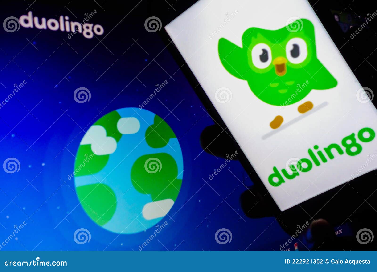 Smartphone with Duolingo Language App Logo on Screen. Blurred ...