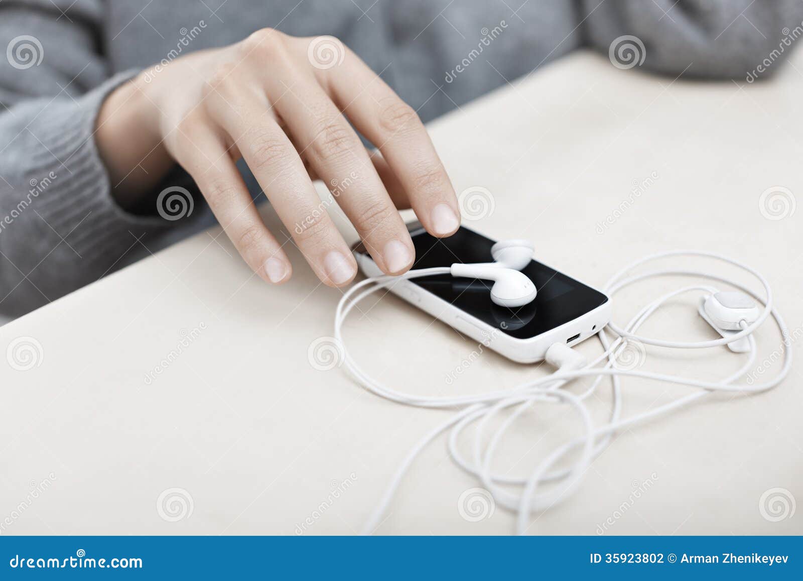 Smartphone with earphones stock photo. Image of gadget - 35923802