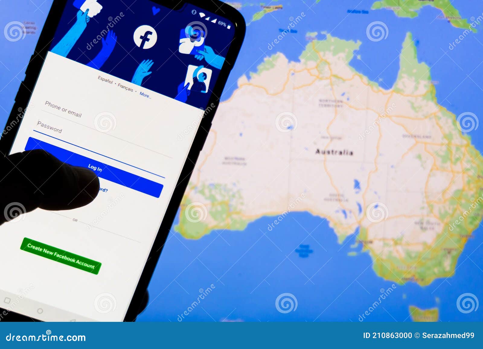 Smartphone with Facebook`s Login Screen Against the Map of Australia in ...