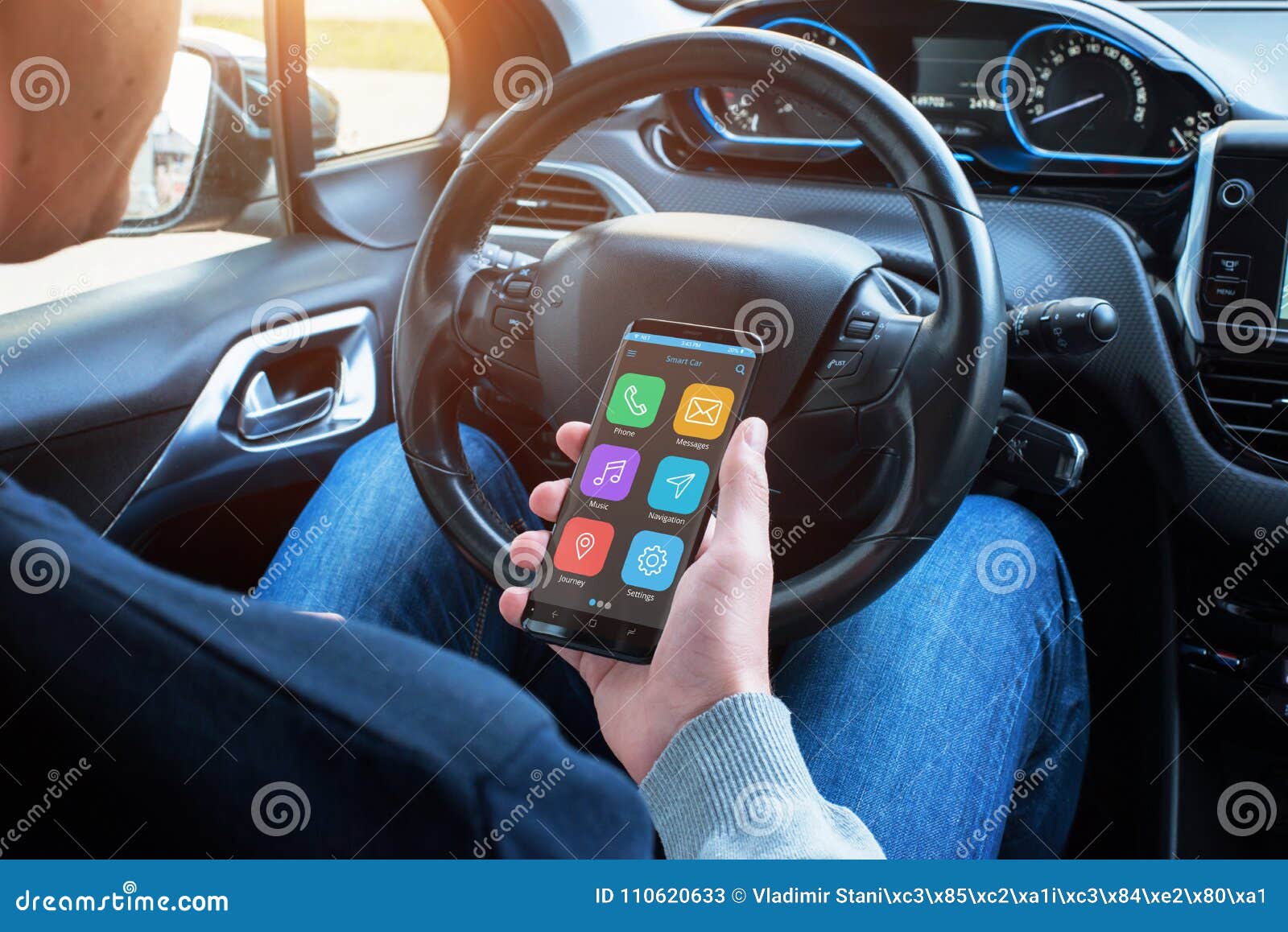 Smartphone in Hands of a Car Driver. the Display Shows an Smart Car App ...