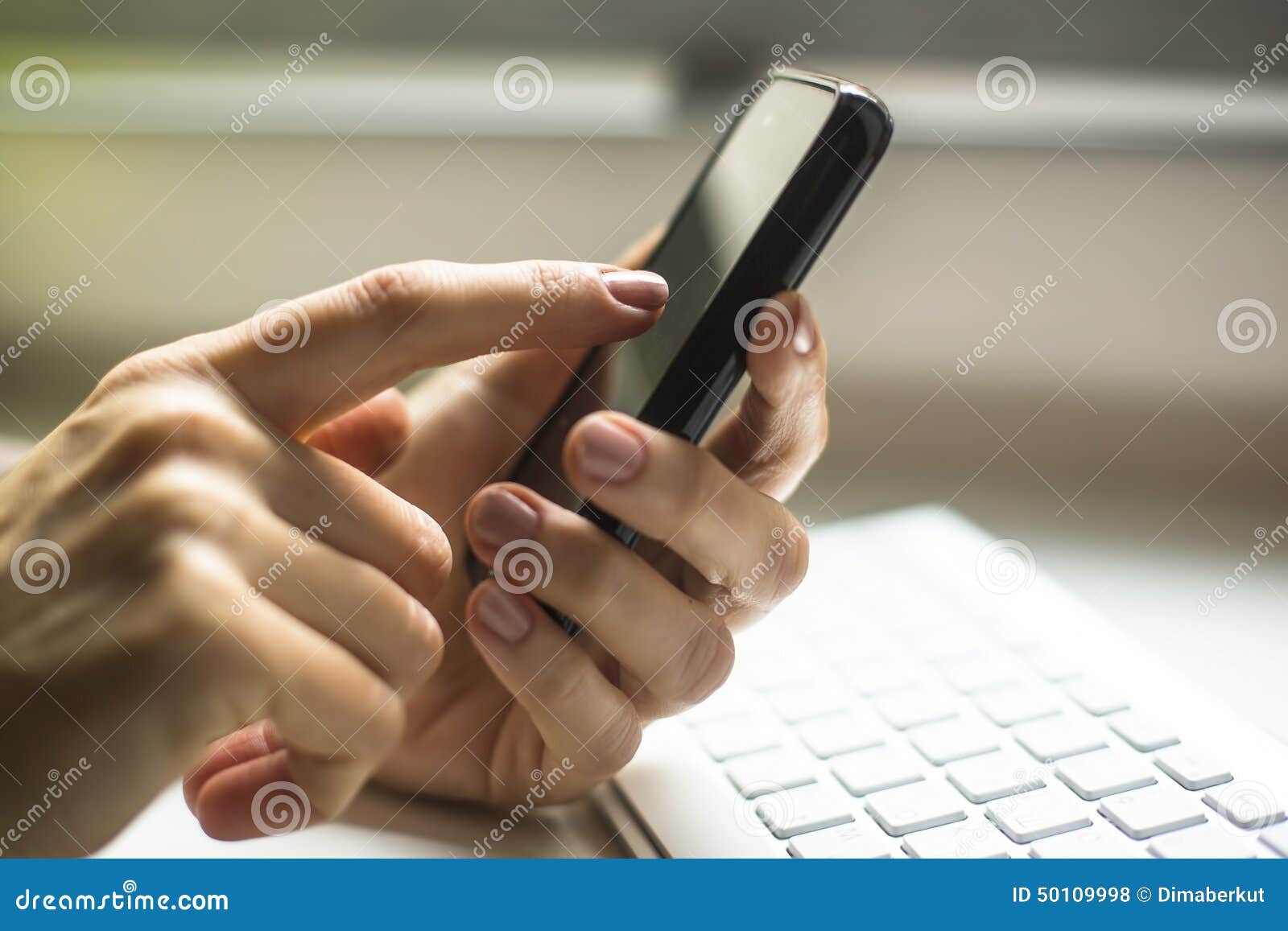 Smartphone in the Hands and Keyboard Computer at Hand. Internet. Stock ...