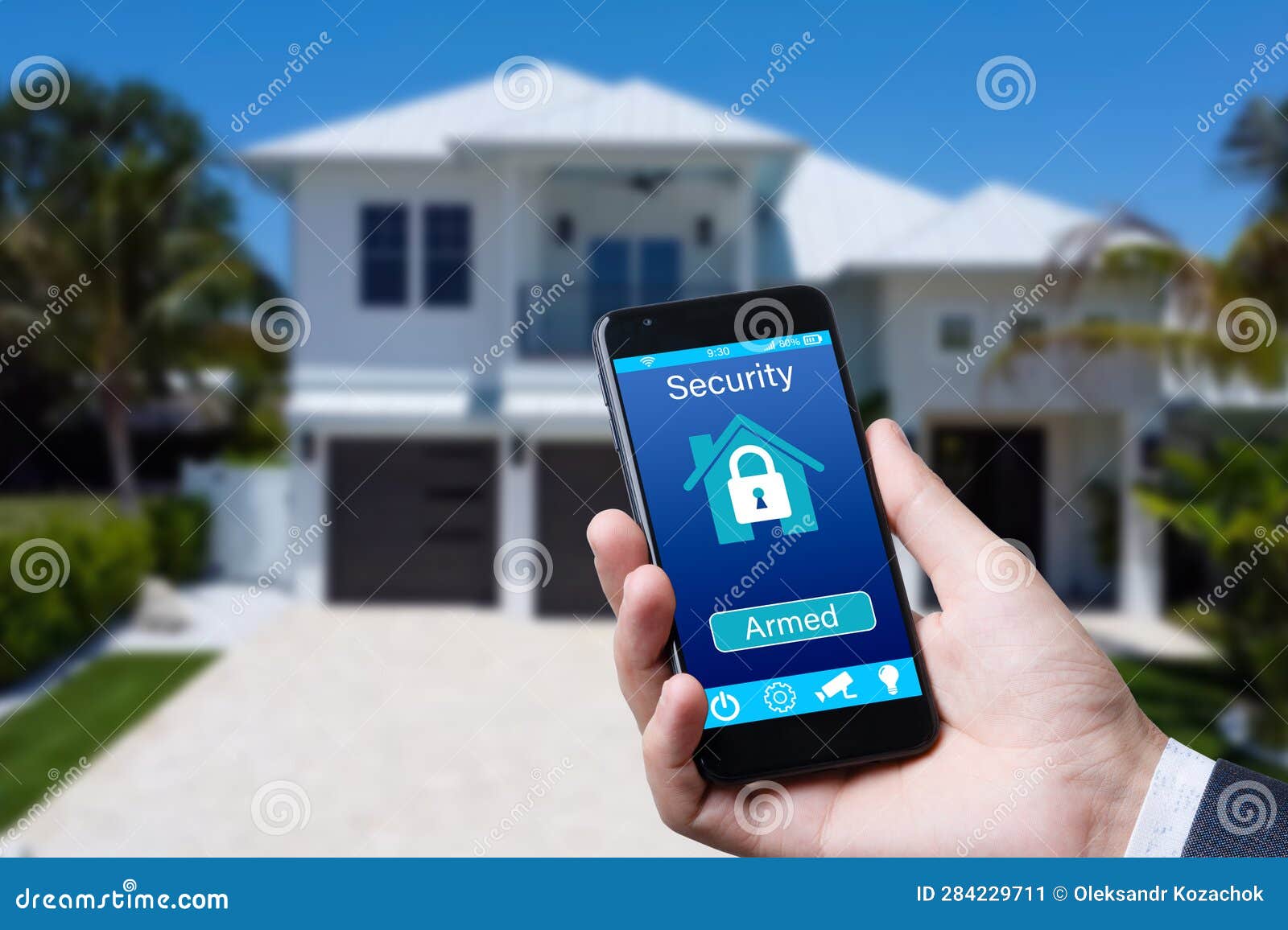 Smartphone with Home Security App in a Hand on the Building Background ...