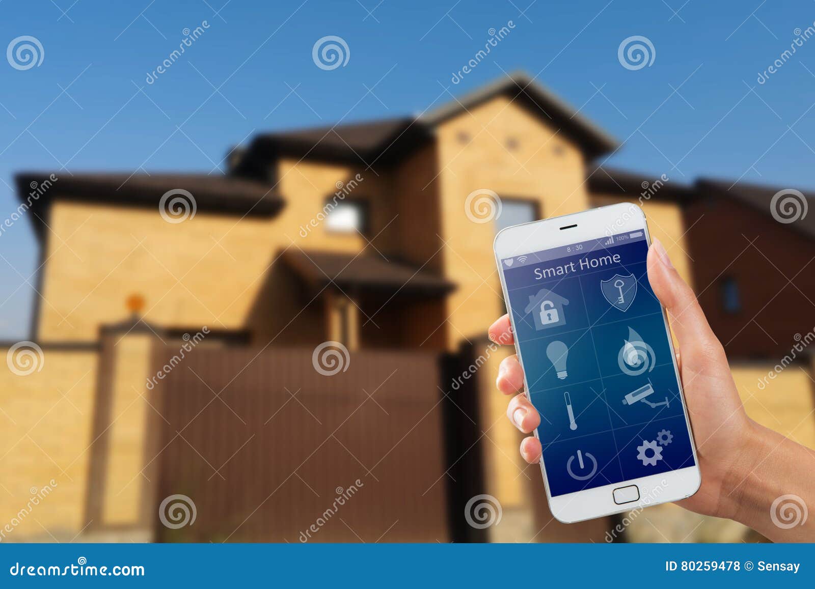 Smartphone with Home Security App in a Hand on the Building Background ...