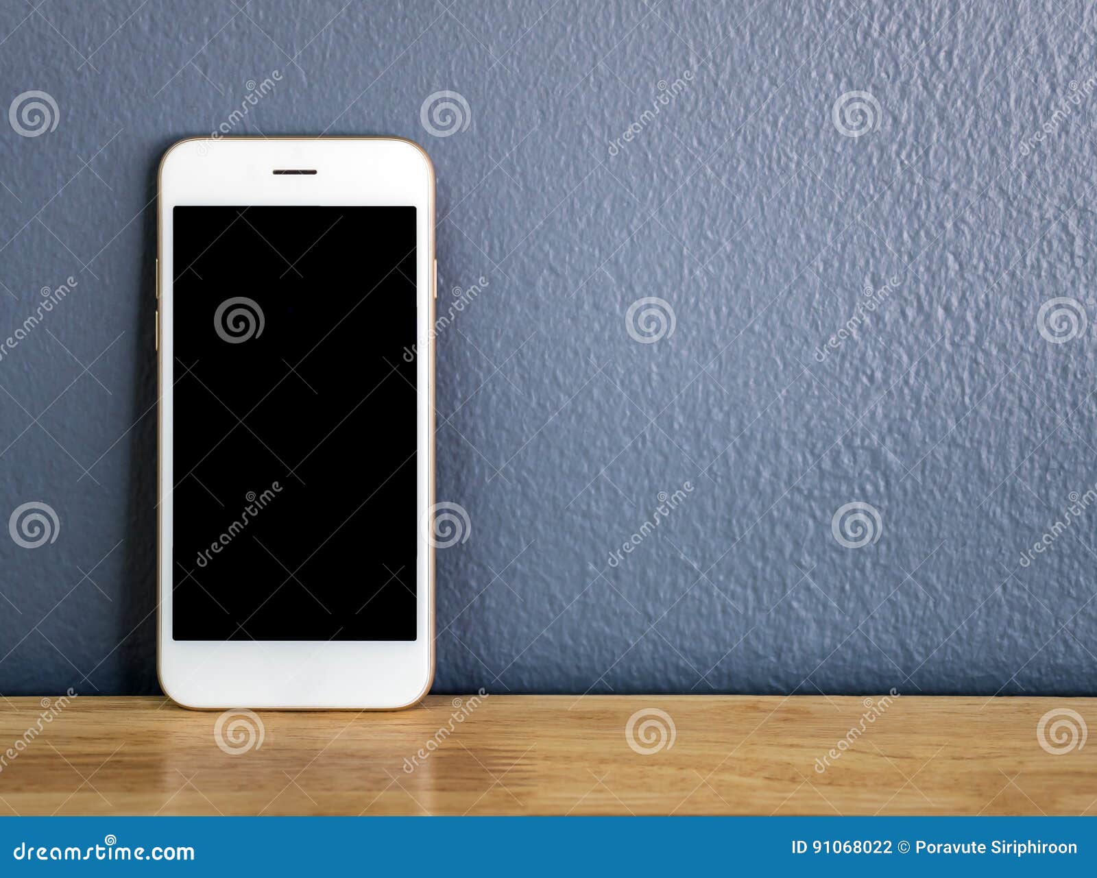 Smartphone Leaning Against the Gray Wall Stock Photo - Image of ...