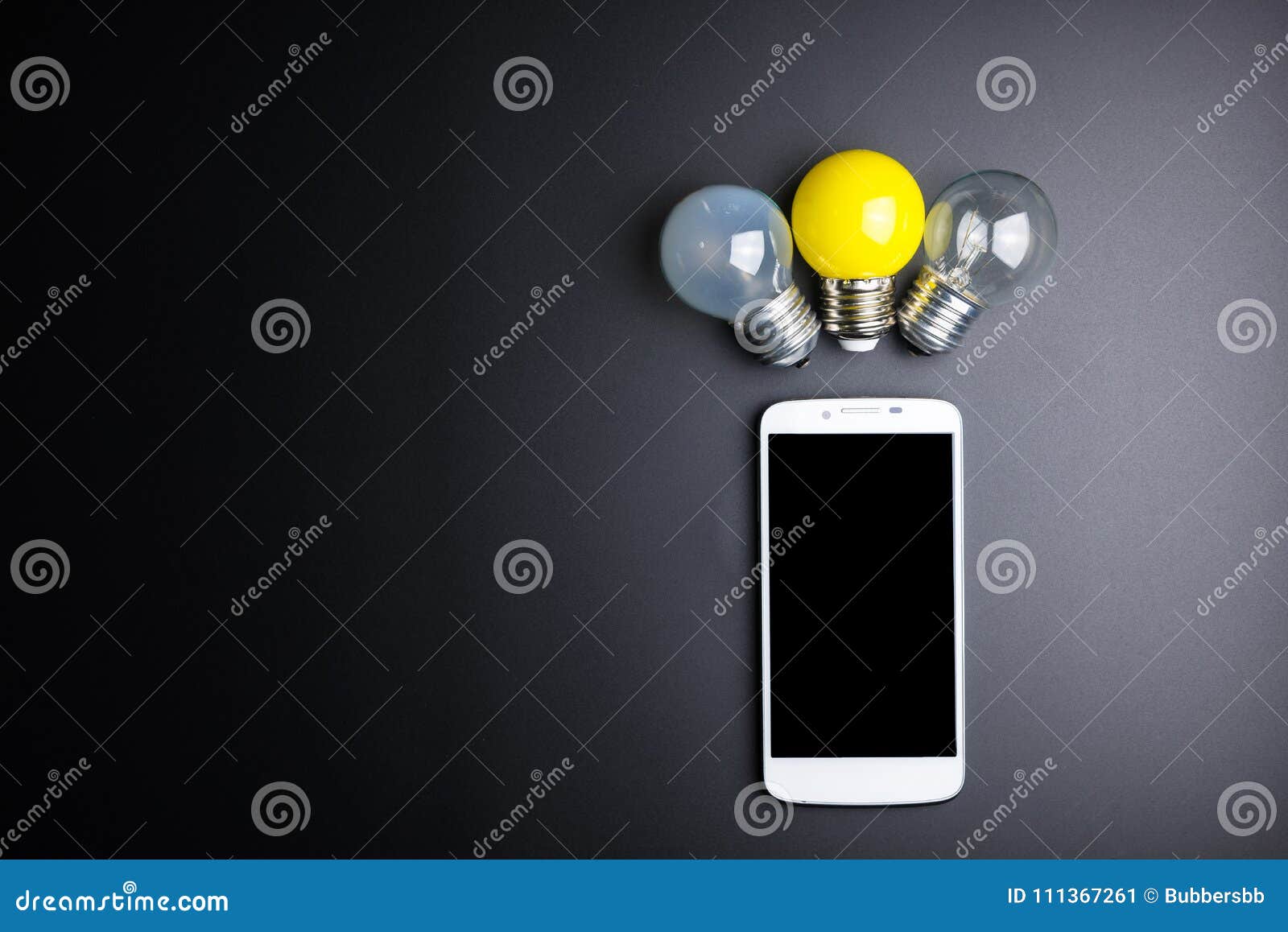 Smartphone and Light Bulb on Black Background with Copy Space. Stock ...