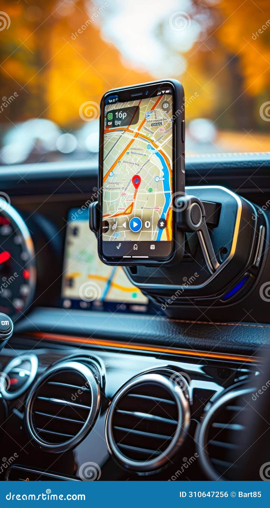 Smartphone Mounted on a Car Dashboard Displaying a Navigation Map Application, Indicating a ...