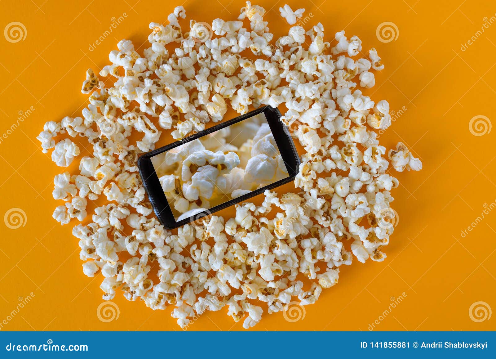 Smartphone and Popcorn on Yellow Table. Technology Concept Stock Image ...