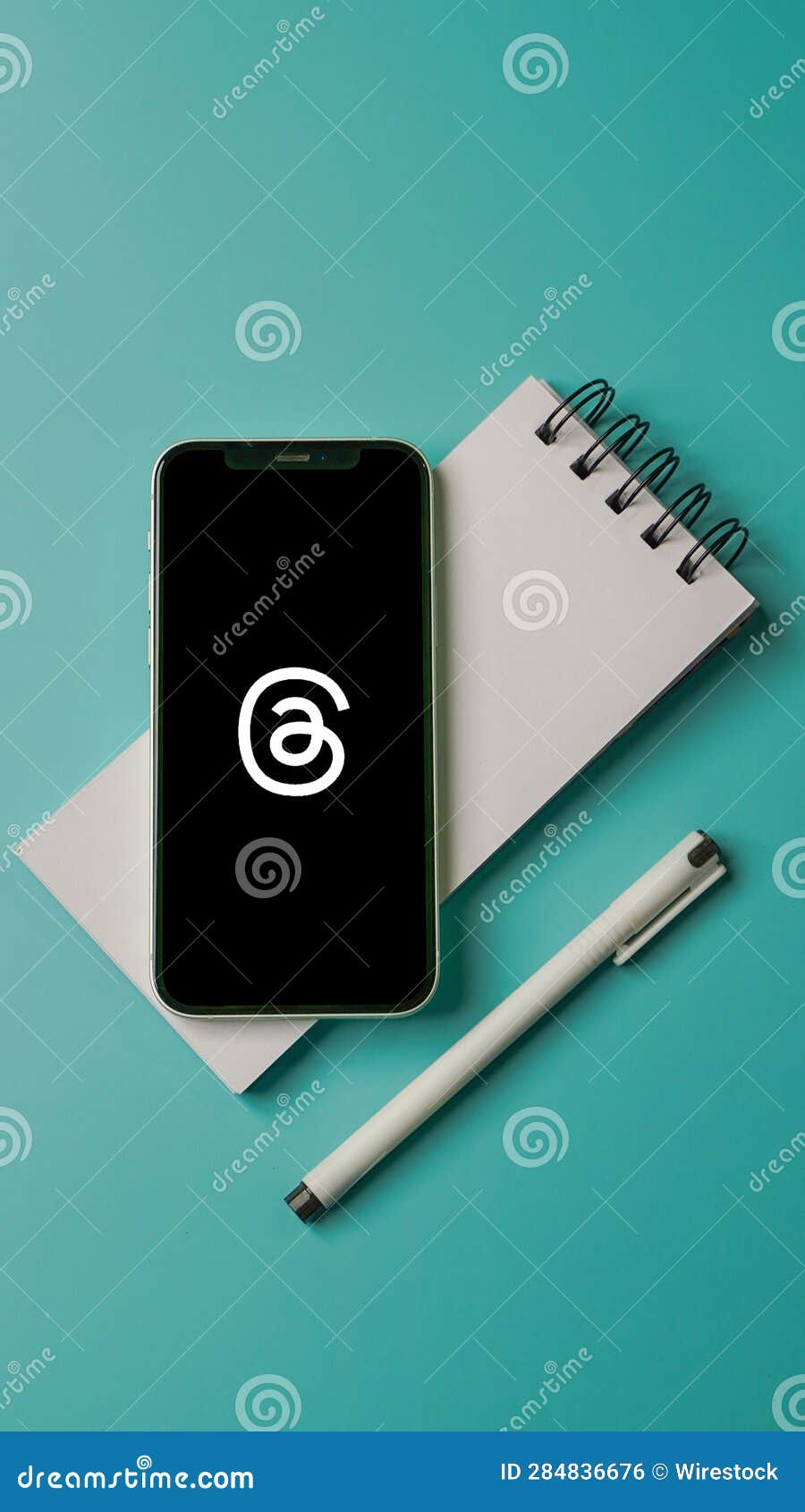 Smartphone Screen with the Threads Meta Logo on a Blue Background with ...