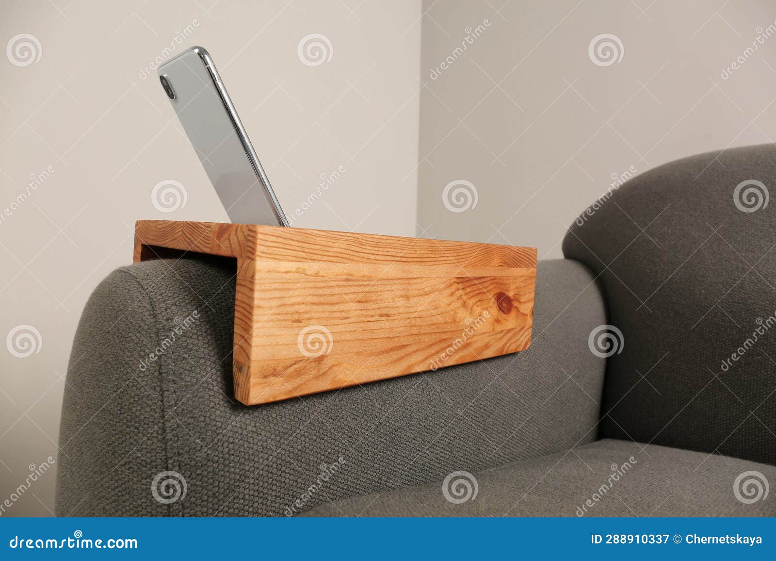 Smartphone on Sofa with Wooden Armrest Table in Room. Interior Element ...