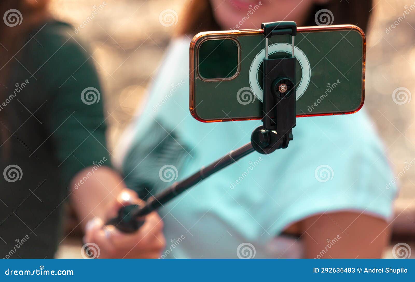 The Smartphone Takes Photos Using a Selfie Stick. Close-up Stock Image ...