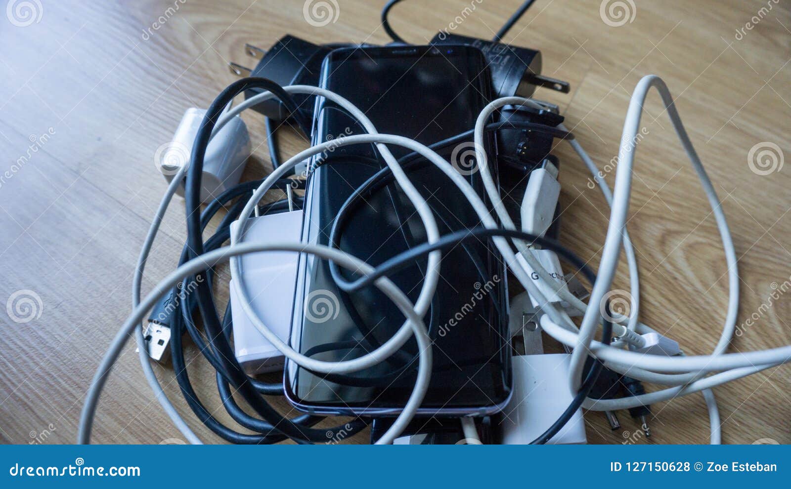 Smartphone Tangled in Differnt Electronics Cables Chargers Usb and ...