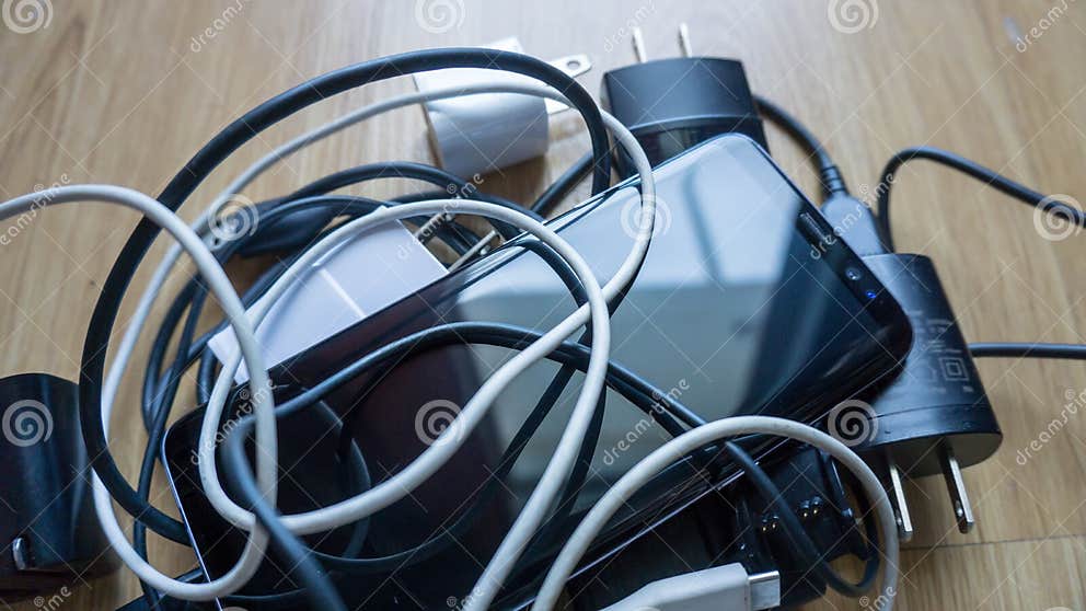 Smartphone Tangled in Differnt Electronics Cables Chargers Usb and ...