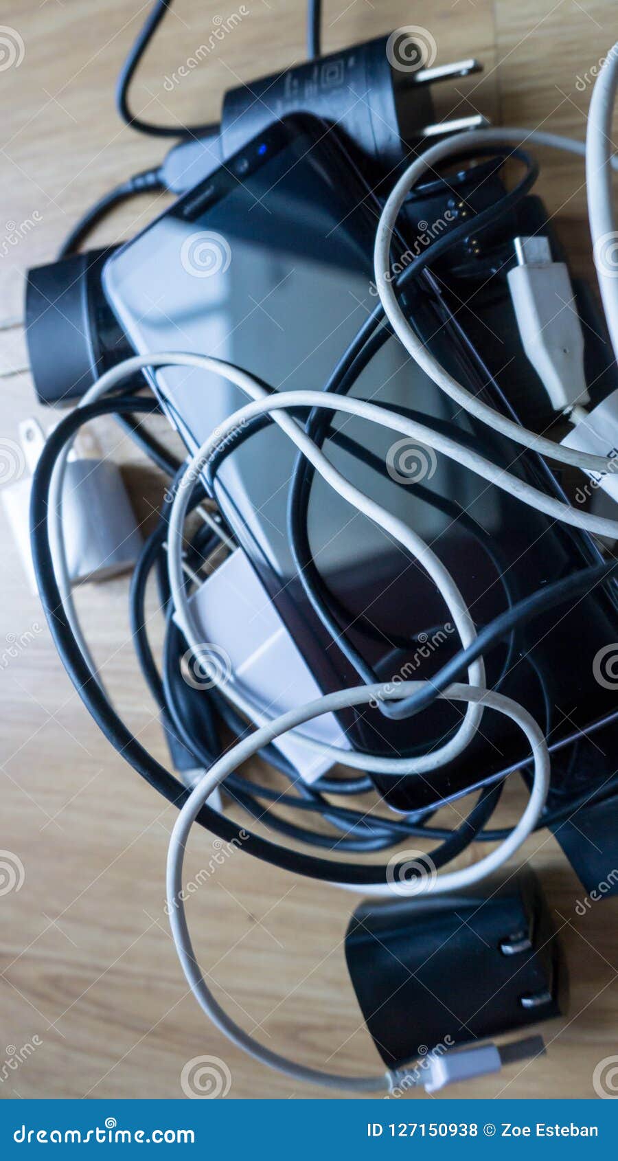 Smartphone Tangled in Differnt Electronics Cables Chargers Usb and ...