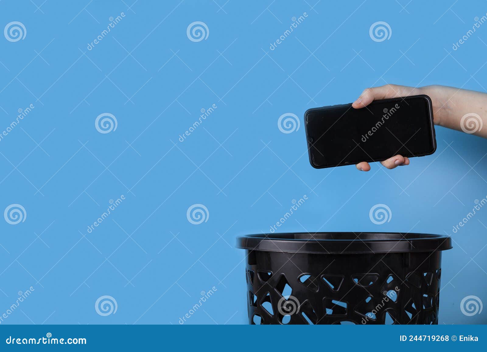 The Smartphone is Thrown into the Trash for Disposal Stock Photo ...