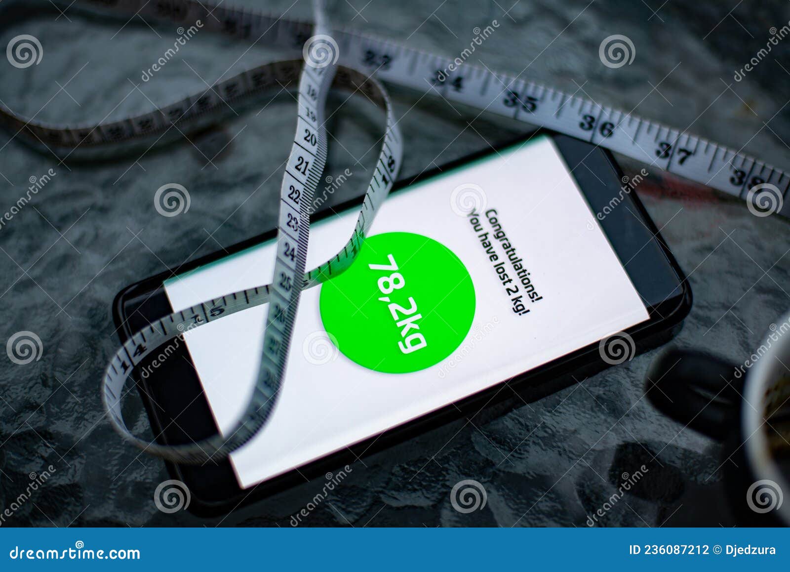 Smartphone with Weight Loss Application and Measuring Meter Stock Photo ...